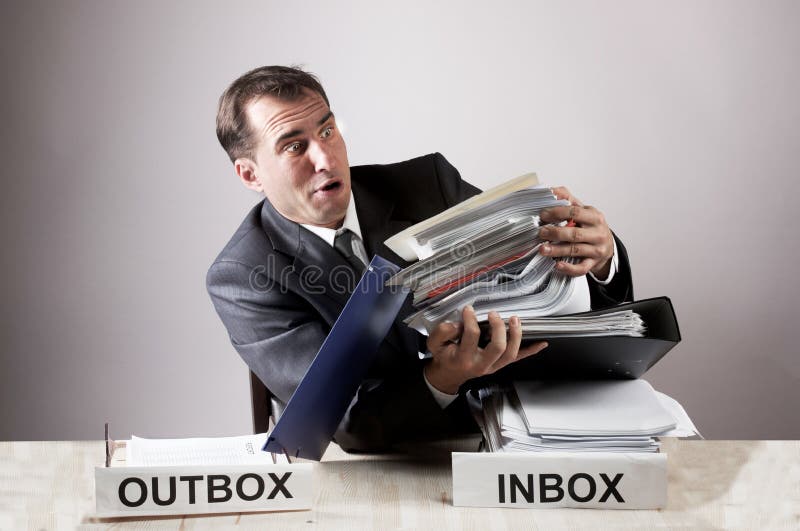Stressed Office Worker with a Paper Stack Stock Photo - Image of ...