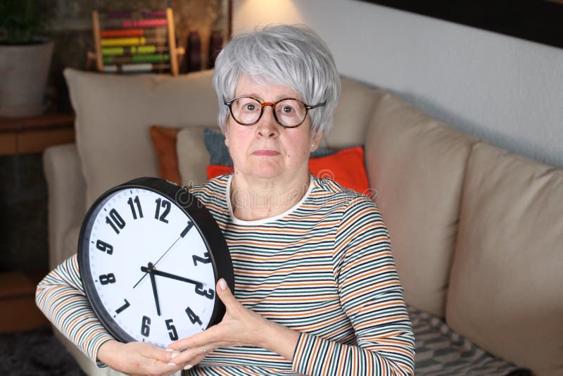 Stressed Out Senior Woman Holding Clock Stock Photo - Image of deadline ...