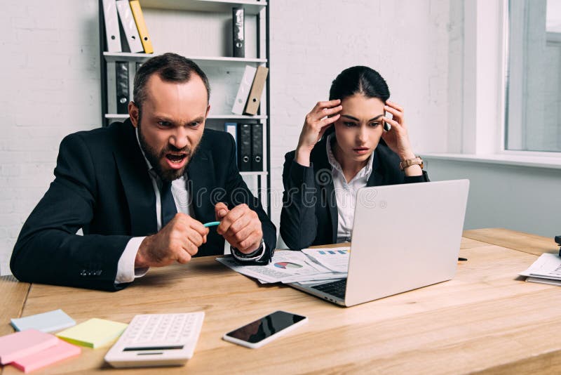 Stressed and Overworked Business People at Workplace with Documents and ...