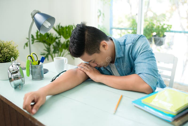Stressed Overworked Man Studying Sleepy on Desk. Stock Photo - Image of ...
