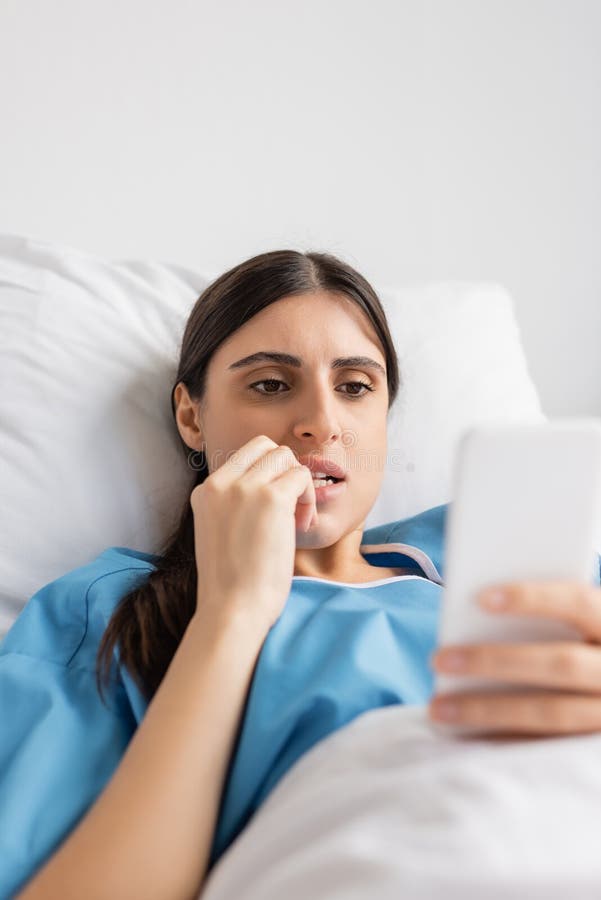 Stressed Patient Using Smartphone while Lying Stock Image - Image of ...