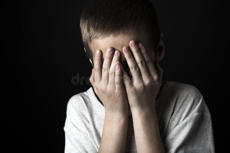 Stressed sad boy on studio stock photo. Image of crying - 74565994
