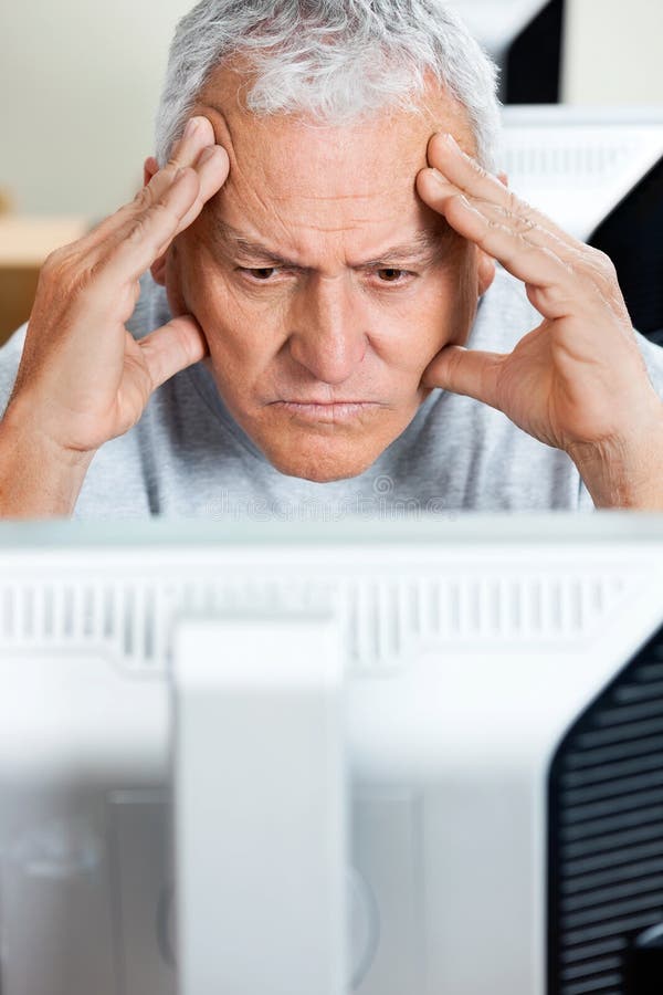 Stressed Senior Man Looking at Computer in Class Stock Photo - Image of ...