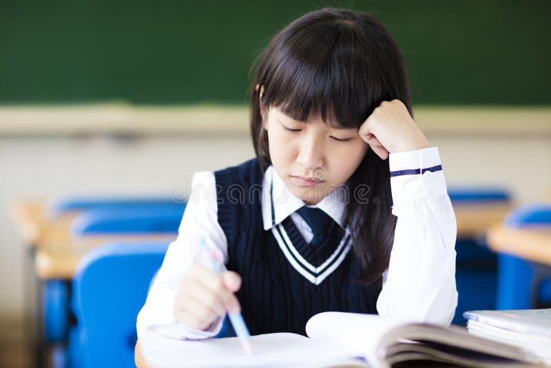 Stressed Student of High School Sitting in Classroom Stock Photo ...