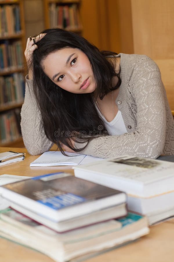 Stressed Student Reading a Book Stock Photo - Image of indoors, holding ...