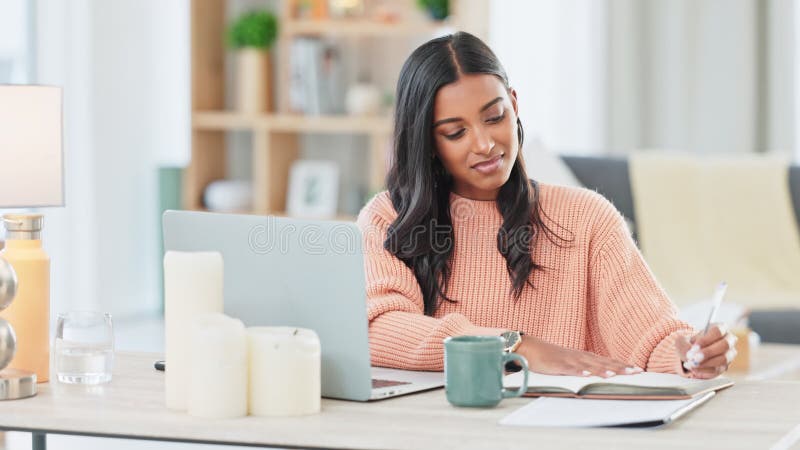 Stressed Student Studying and Taking Notes in the Library Surrounded by ...