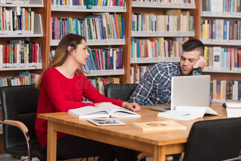 Stressed Students Doing Their Homework at the Desk Stock Photo - Image ...