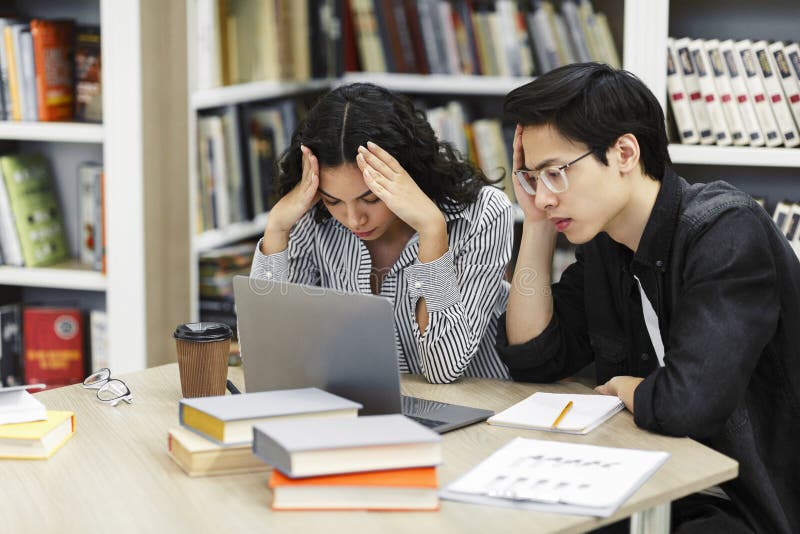Two Sad Students Read Library Stock Photos - Free & Royalty-Free Stock ...