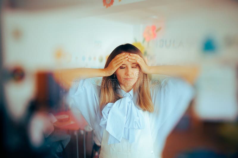 Stressed Teacher Feeling Overwhelmed in a Classroom Stock Photo - Image ...