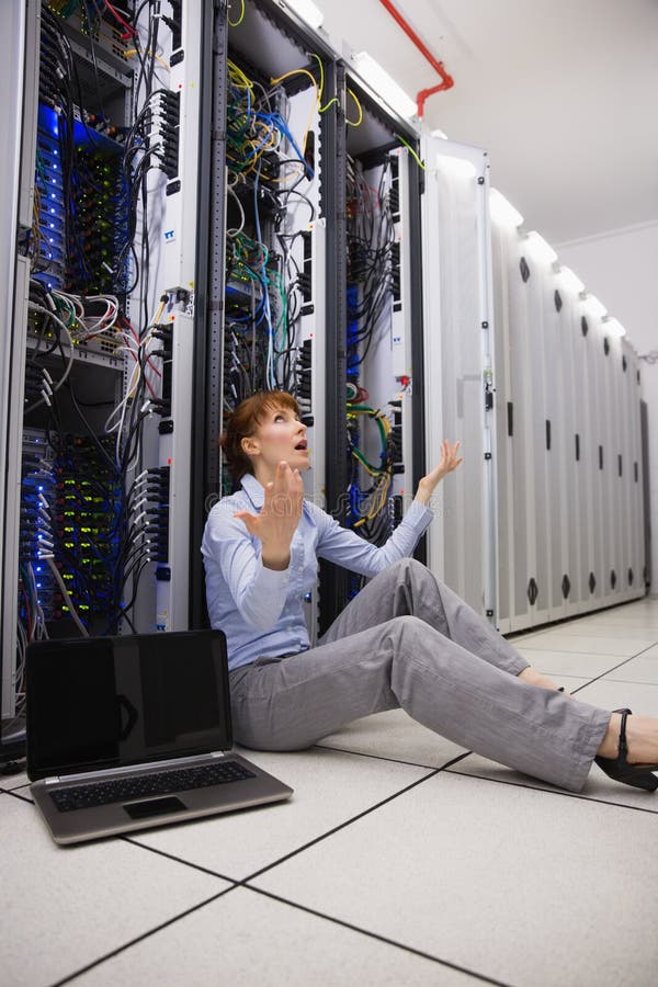 Stressed Technician Sitting on Floor and Looking at Laptop Stock Photo ...