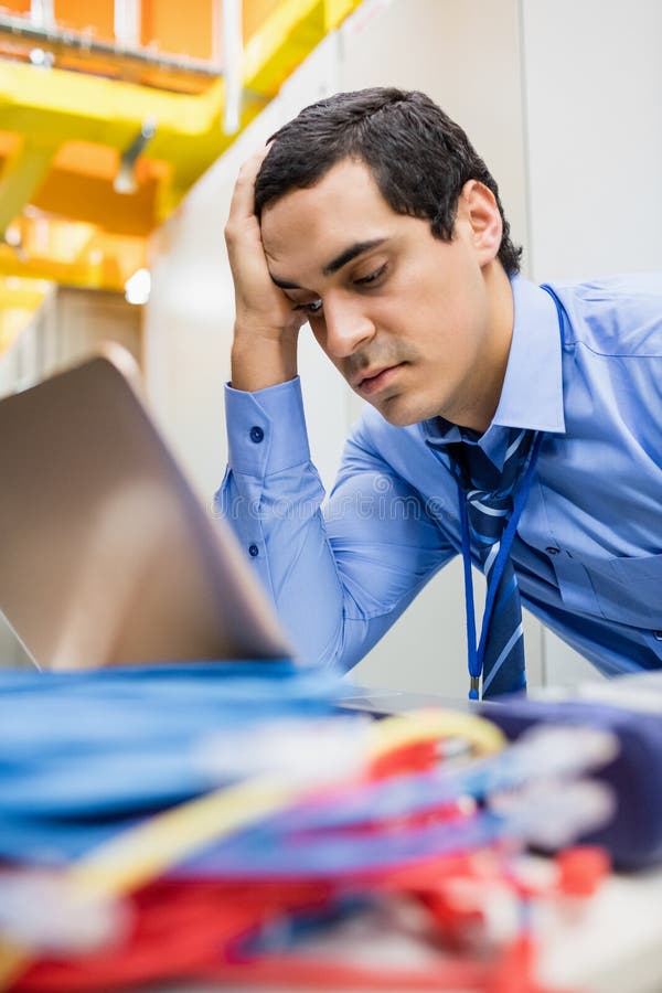 Stressed Technician Using Laptop Stock Image - Image of company ...