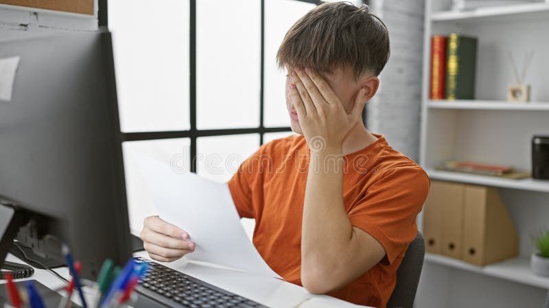 Stressed Teen Boy Studying with Papers at Desk Indoors Stock Image ...