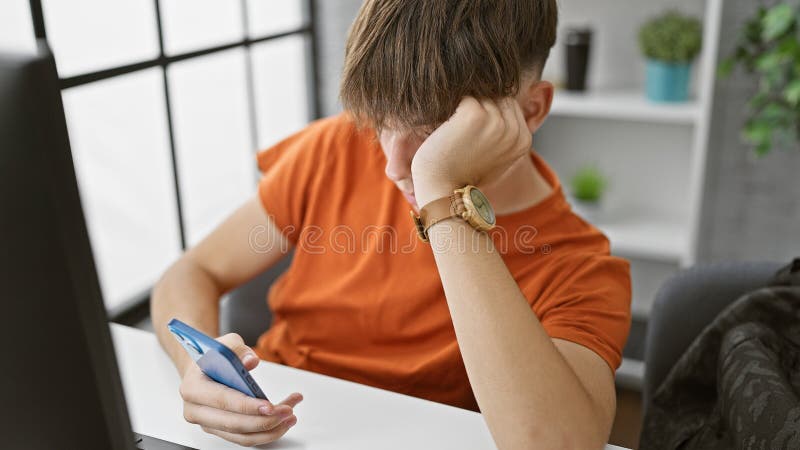 Stressed Teenager Studying with Smartphone in Modern Classroom Stock ...