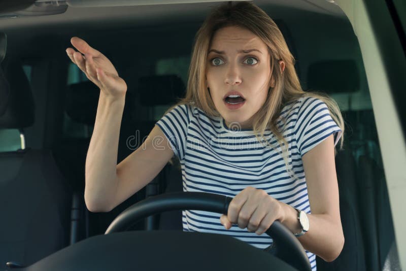 Stressed Woman in Driver`s Seat of Modern Car, View through Windshield ...
