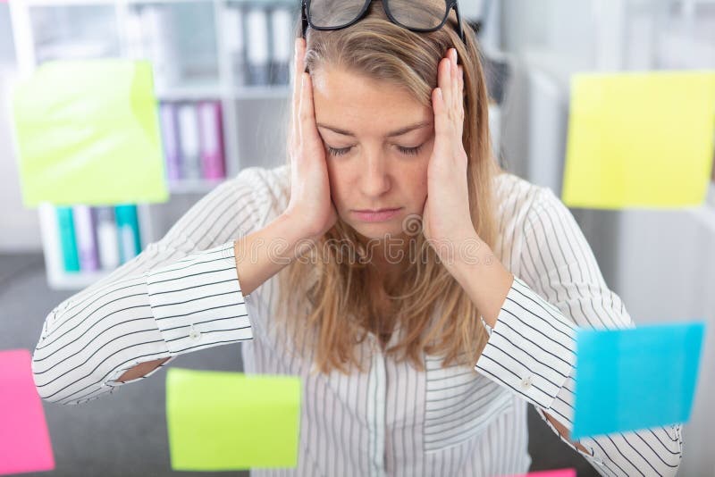 Stressed Woman Looking at Post it Notes in Office Stock Photo - Image ...