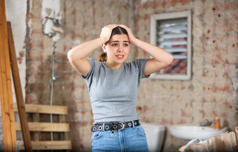 Stressed Woman Standing on Indoor Construction Site Stock Photo - Image ...