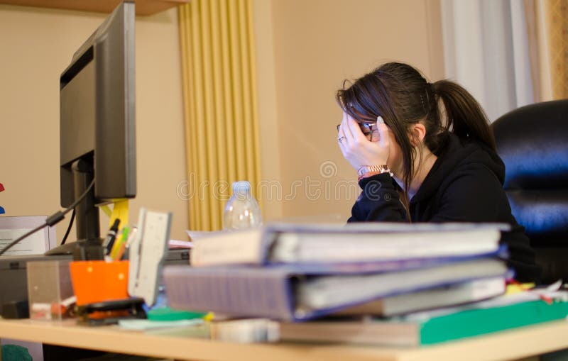 Stressed Woman at Work with Computer in Front of Her Stock Photo ...