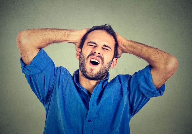 Stressed Young Man Running Out of Time Looking at Wall Clock Stock ...
