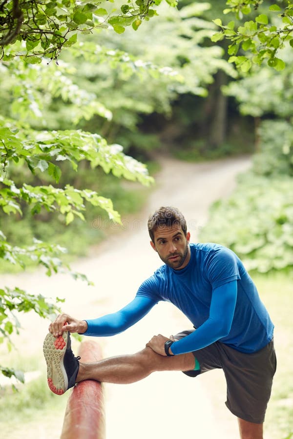 Stretch for a Better Workout. a Sporty Man Starting His Exercise ...