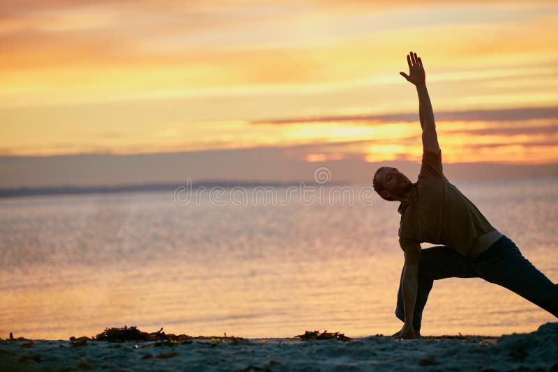 Stretch the Body, Stretch the Mind. a Man Practicing the Triangle Pose ...