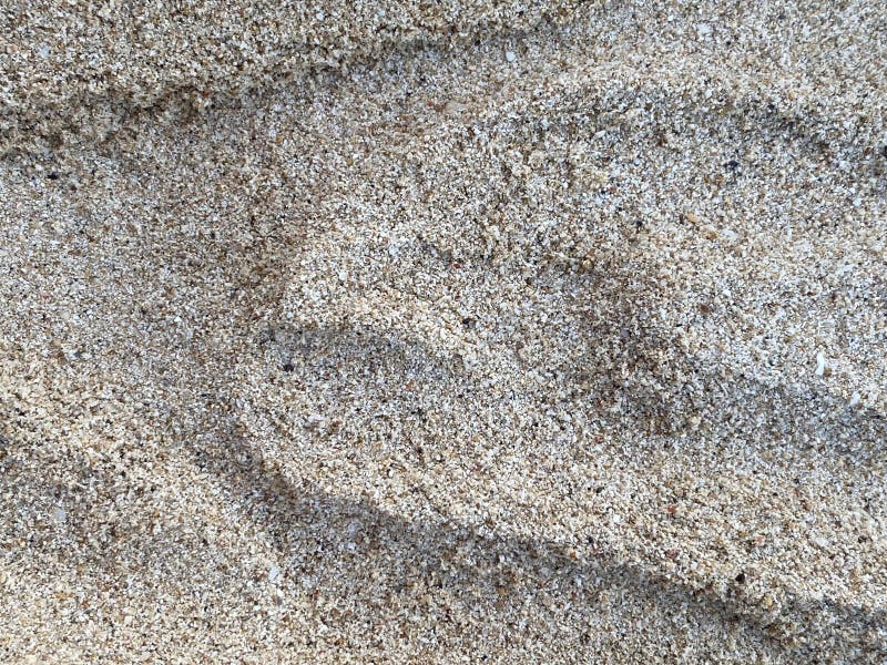 A stretch of clean sand stock image. Image of rock, gravel - 302725059