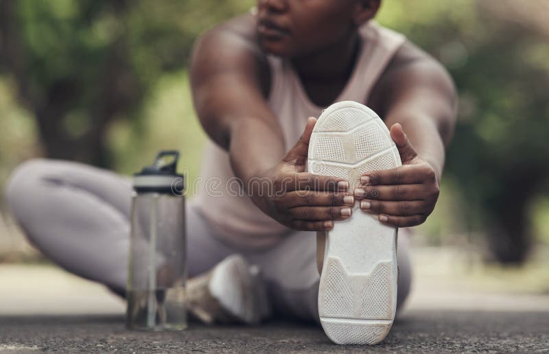 Stretch Out those Leg Muscles. a Woman Stretching before a Workout ...