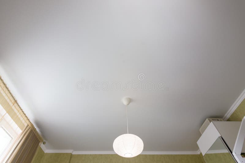 Stretch White Matte Ceiling Close-up in a Bedroom Stock Photo - Image ...