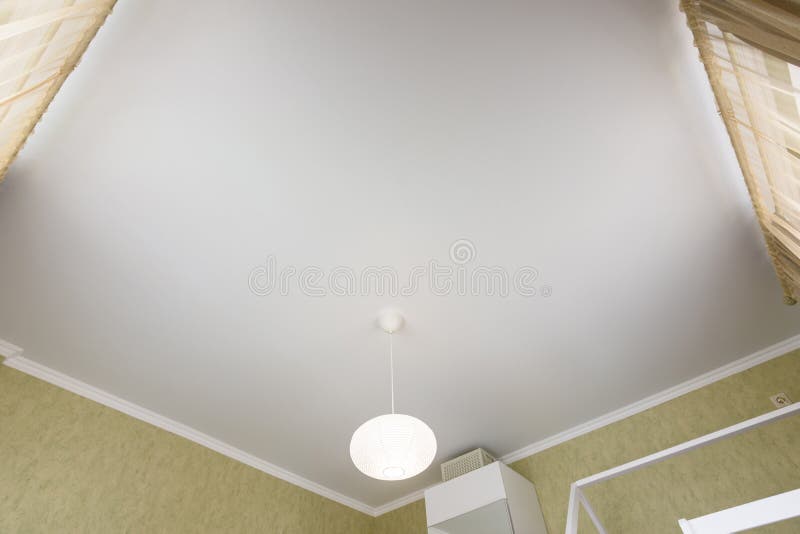 Stretch White Matte Ceiling Close-up in the Interior of a Bedroom Stock ...