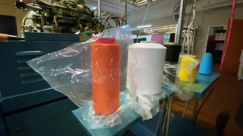 Stretched Thread is Unwound in Sewing Process at Textile Factory. Stock ...
