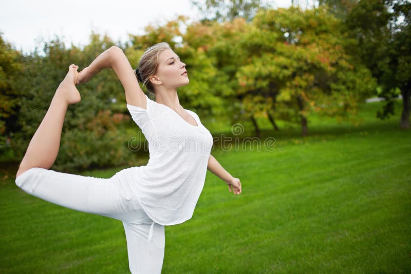 Beautiful Young Woman Doing Yoga Outside Stock Photo - Image of body ...