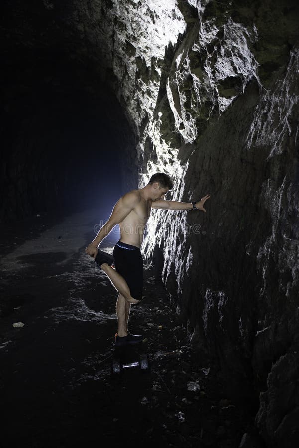 Stretching Exercise in a Cave Stock Image - Image of healthy, male ...