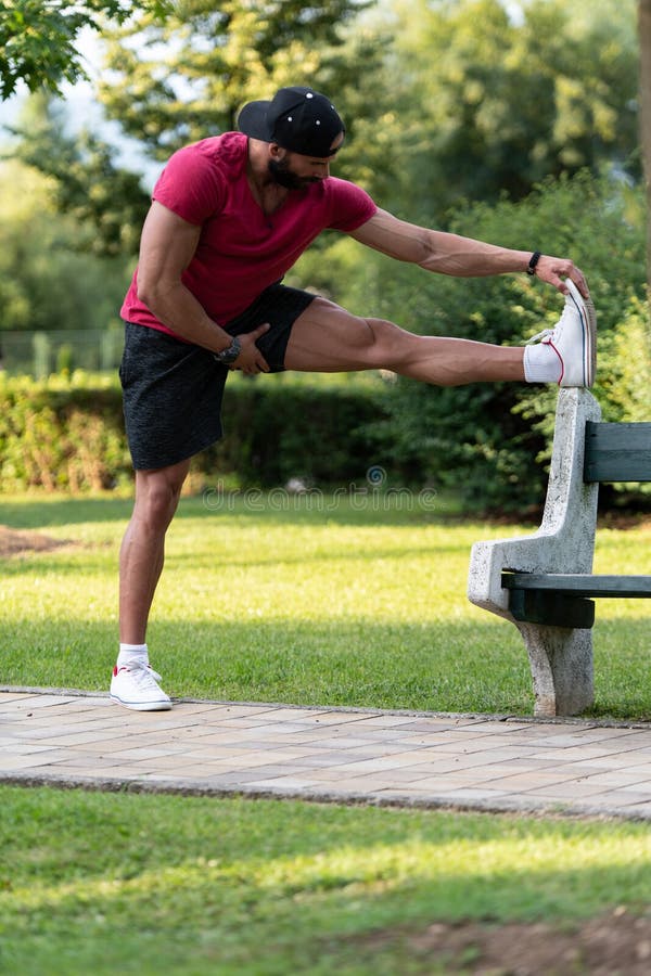 Stretching after Jogging stock image. Image of equipment - 183107193