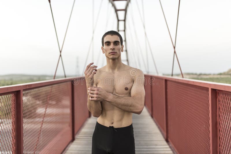 Stretching Man on Pedestrian Bridge Portrait Stock Photo - Image of ...