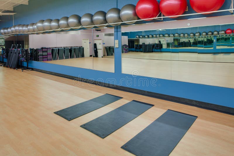 Stretching Mats and Exercise Balls in Gym Stock Image - Image of neat ...