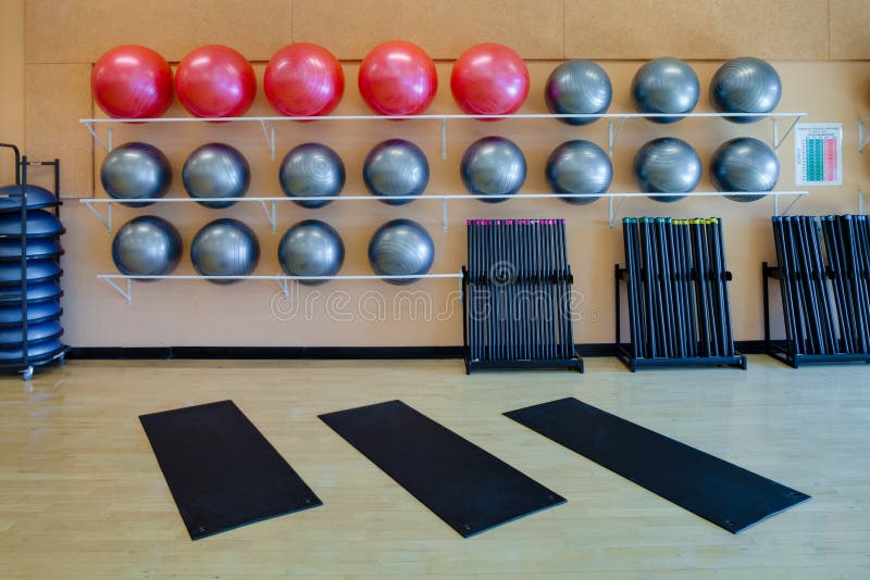 Stretching Mats and Exercise Balls in Gym Stock Photo - Image of ...