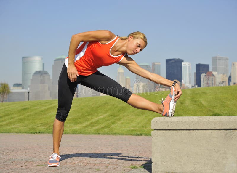 Stretching in Urban Park stock image. Image of buildings - 15714413