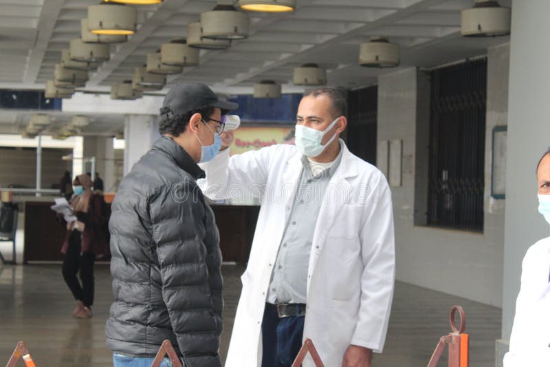 Strict Precautionary Measures before a Building Entry, Temperature ...