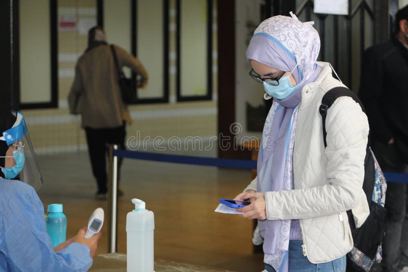 Strict Precautionary Measures before a Building Entry, Temperature ...