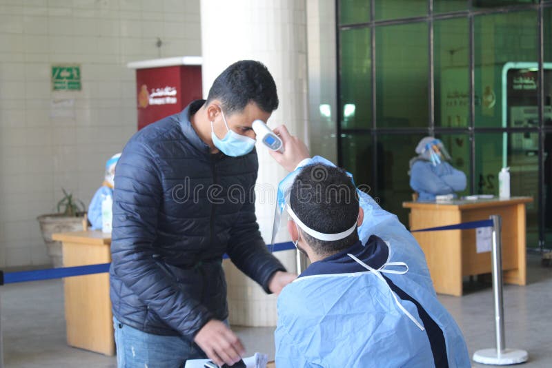 Strict Precautionary Measures before a Building Entry, Temperature ...