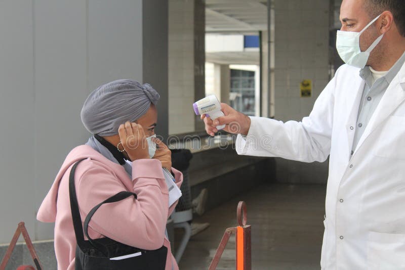 Strict Precautionary Measures before a Building Entry, Temperature ...