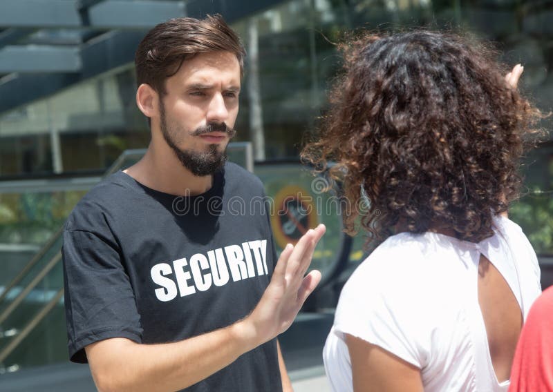 Strict Security Guard with Guests at the Entrance Stock Photo - Image ...