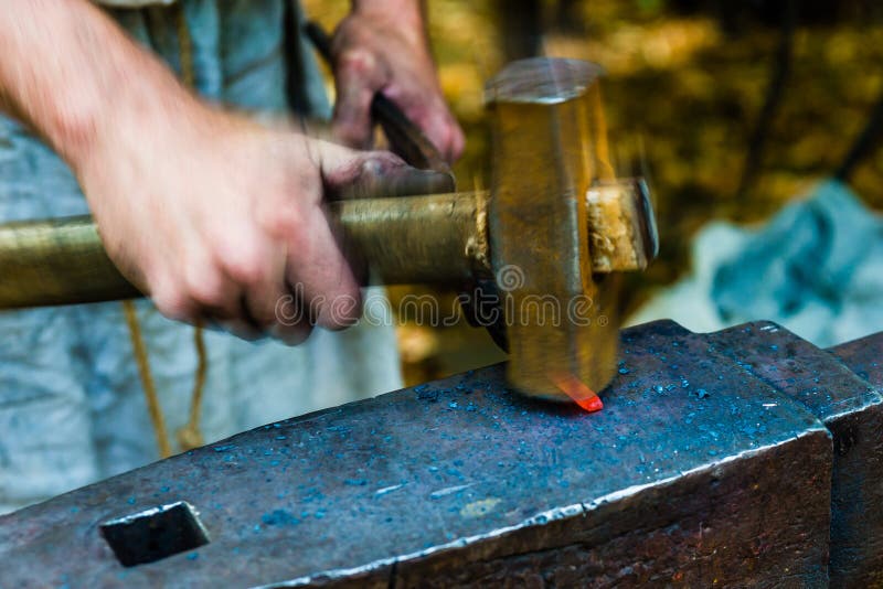 Strike the Iron while it is Hot Stock Photo - Image of ironsmith ...