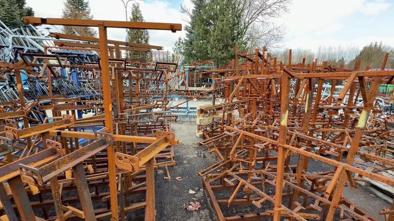 A Rustic Scrapyard Filled with Rusty Metal Frames and Various ...