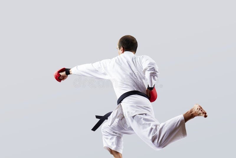 Striking a Hand in a Jump in the Performance of an Athlete in a White ...