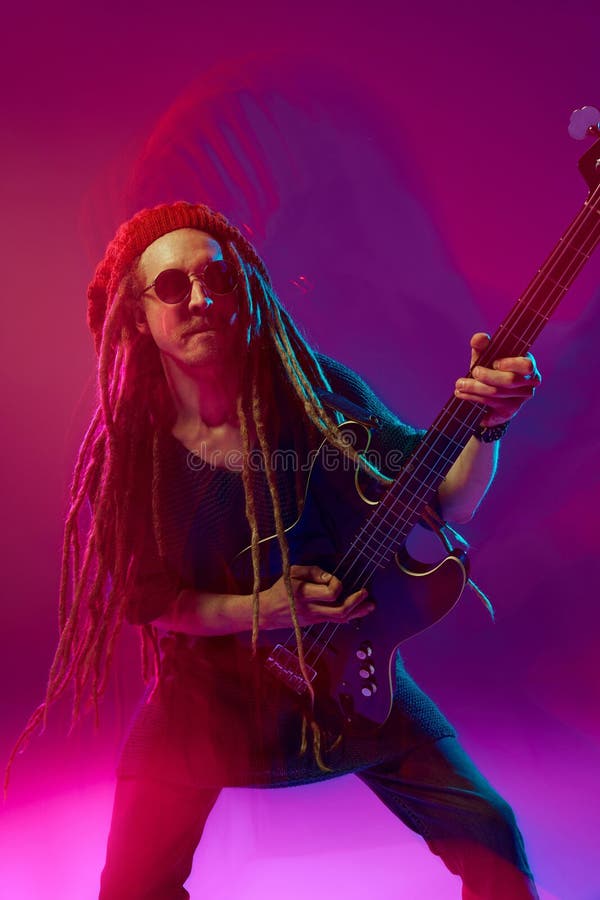 Striking Image of Man with Dreadlocks, Wearing Sunglasses and Beanie ... Striking Image of Man with Dreadlocks, Wearing Sunglasses and Beanie ...