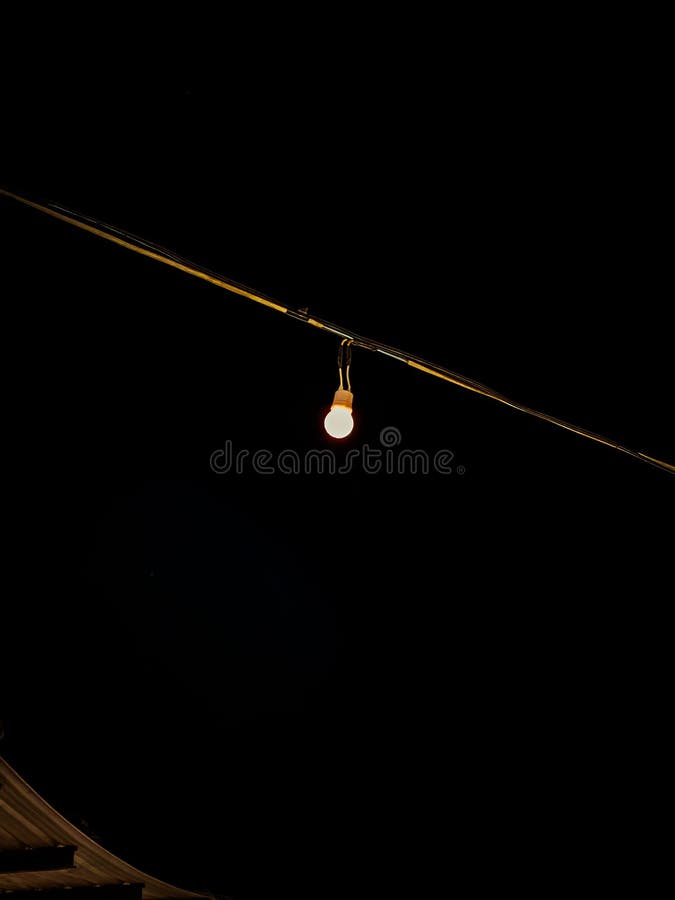 A Striking Minimalist Composition Featuring a Vertical Light Bulb ...