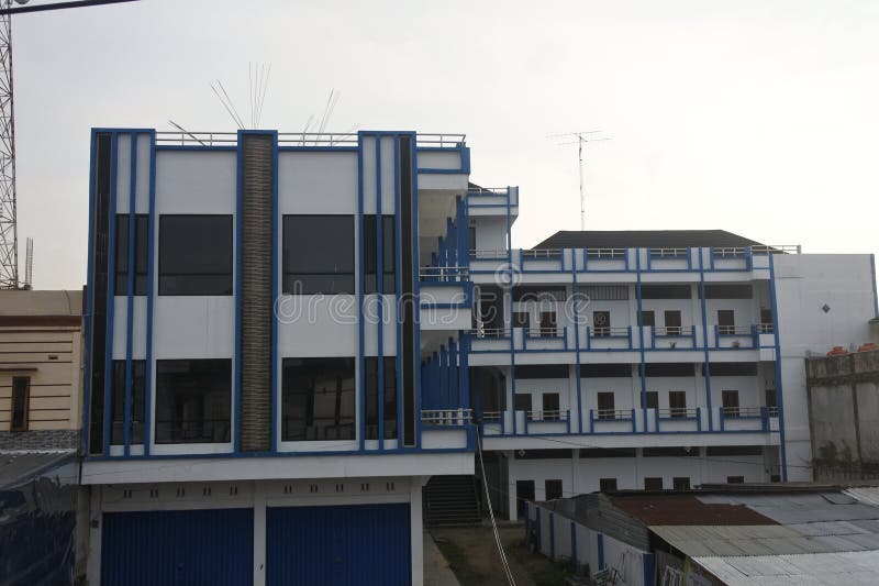 Modern Multi-Story Building with Blue Accents and Bold Architecture ...