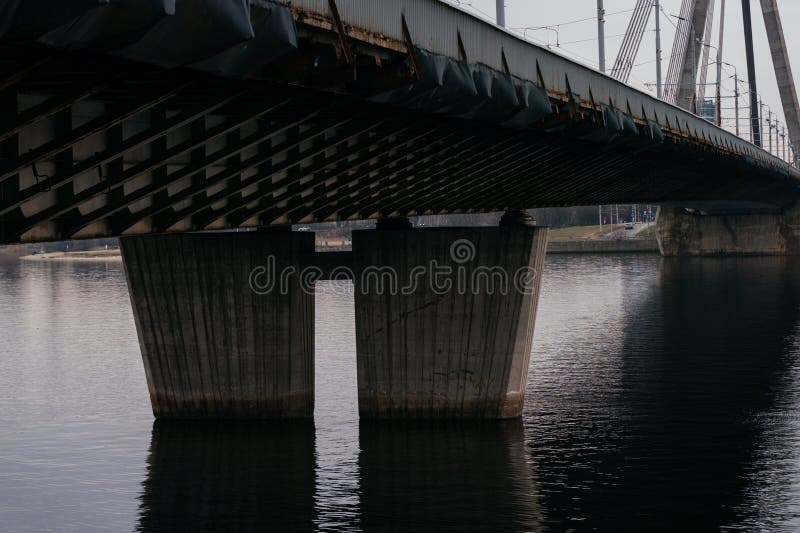 A Striking Perspective of a Cable-stayed Bridge Over a Calm River ...