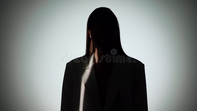 Dramatic Portrait of Woman in Shadow and Light Beam Stock Footage ...