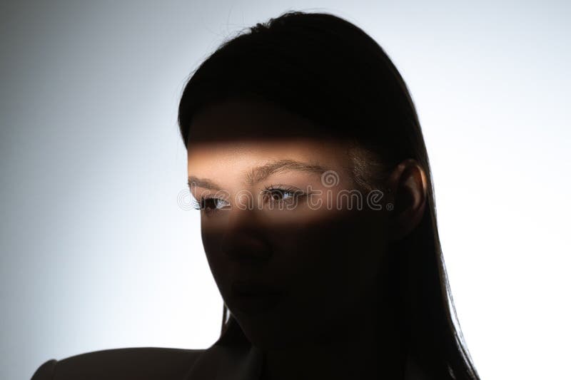 Moody Portrait of Woman in Dramatic Light Beam Stock Image - Image of ...